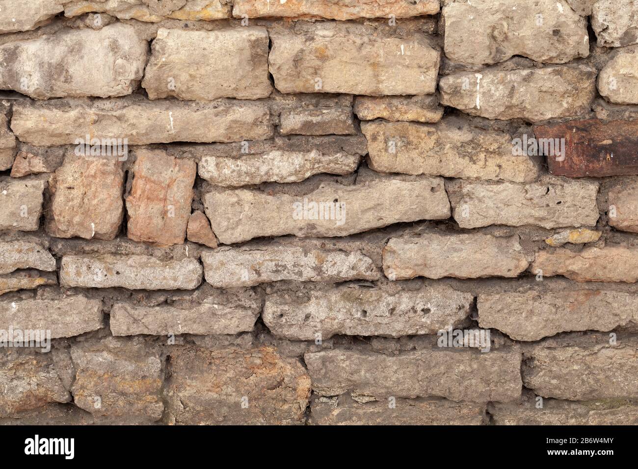 Old grungy wall made of rough stone blocks, flat background photo ...