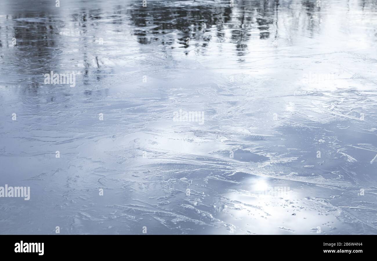 Frozen lake shiny blue ice surface with reflections, natural background ...