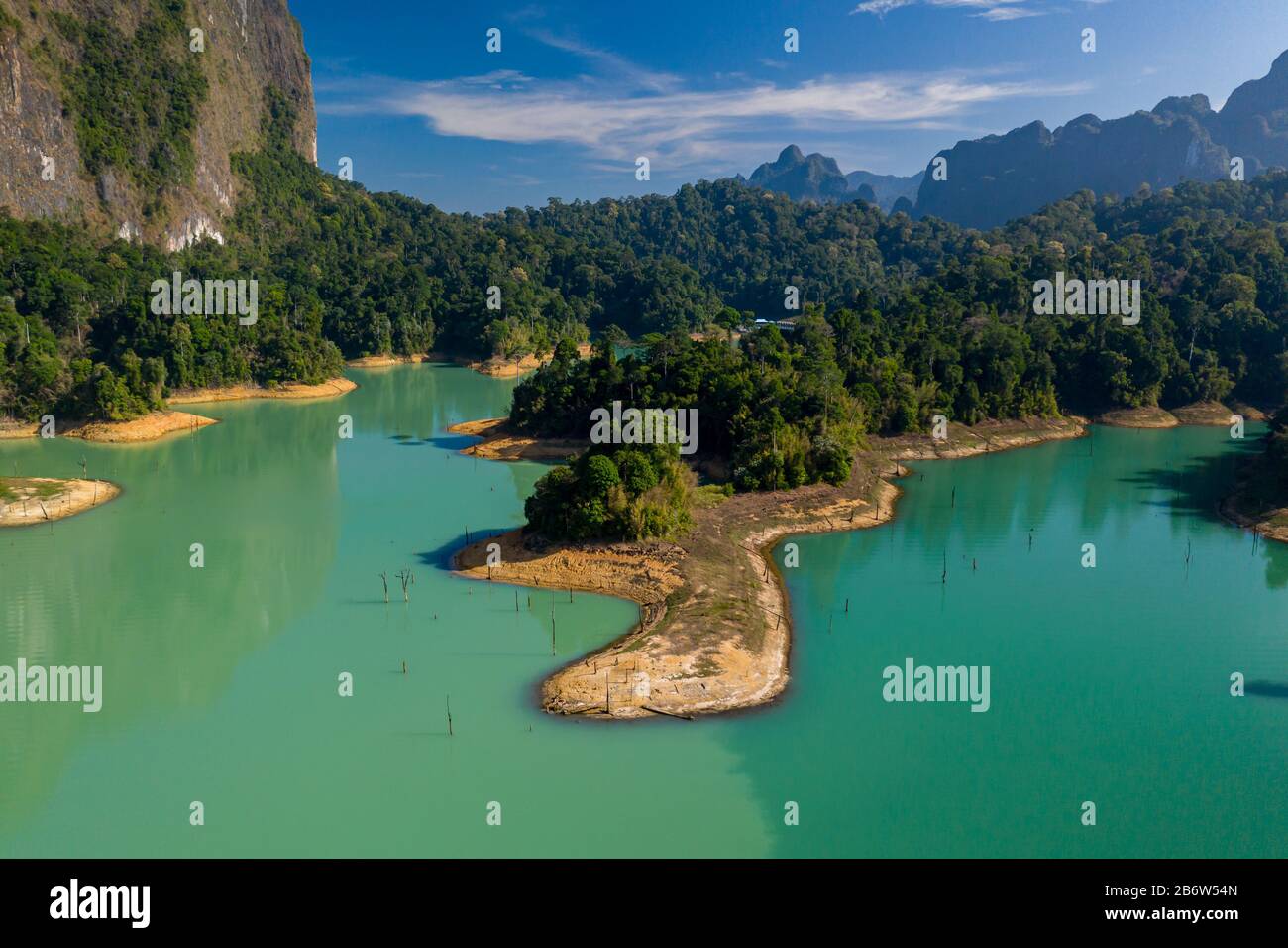 Aerial view of tiny fingers of tropical rainforest extending into a ...