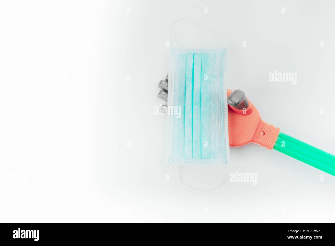 robotic hand holds surgical virus protection mask in white background ...