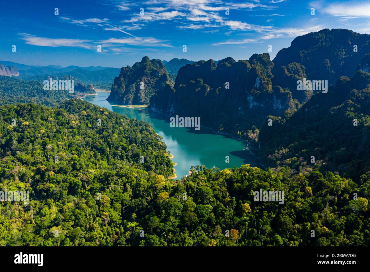 Aerial drone shot of dense tropical rainforest and towering limestone ...