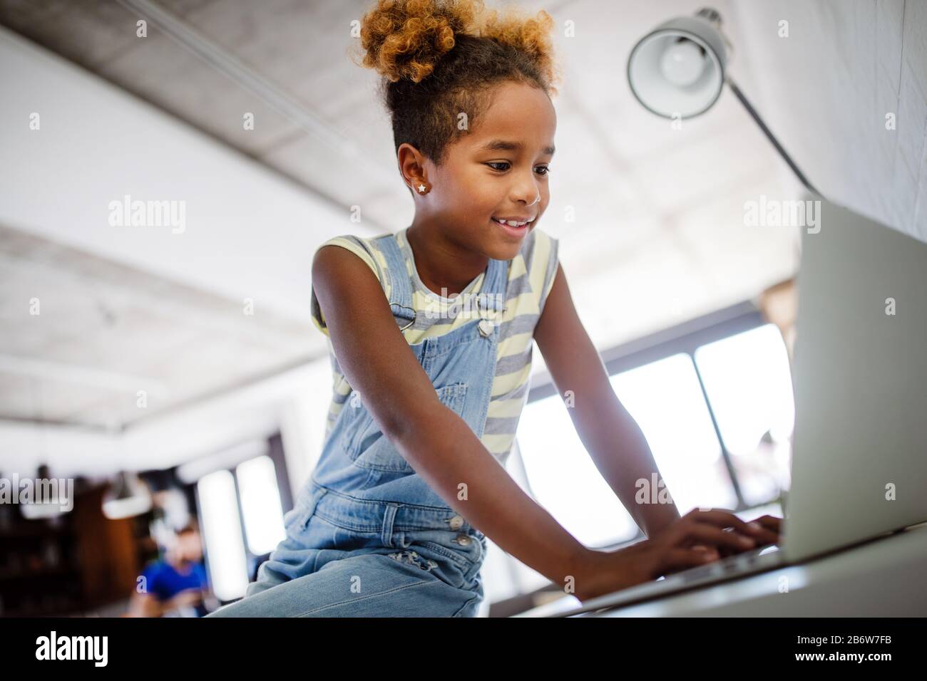 Game, study, fun concept. Happy children spending time with notebook ...