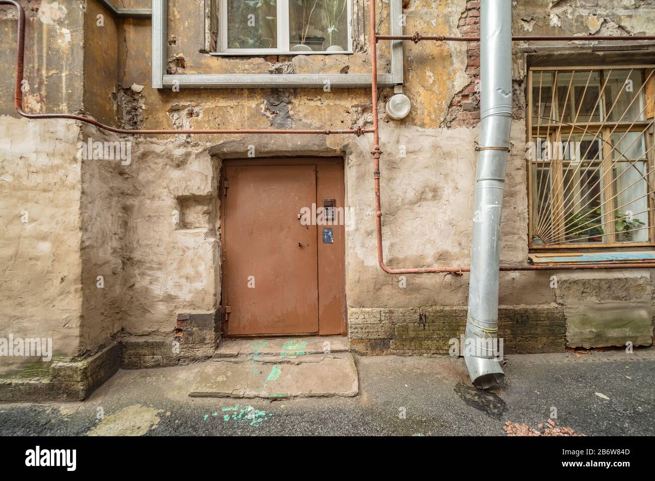 Old rusty neglected brick city residential building entrance living ...
