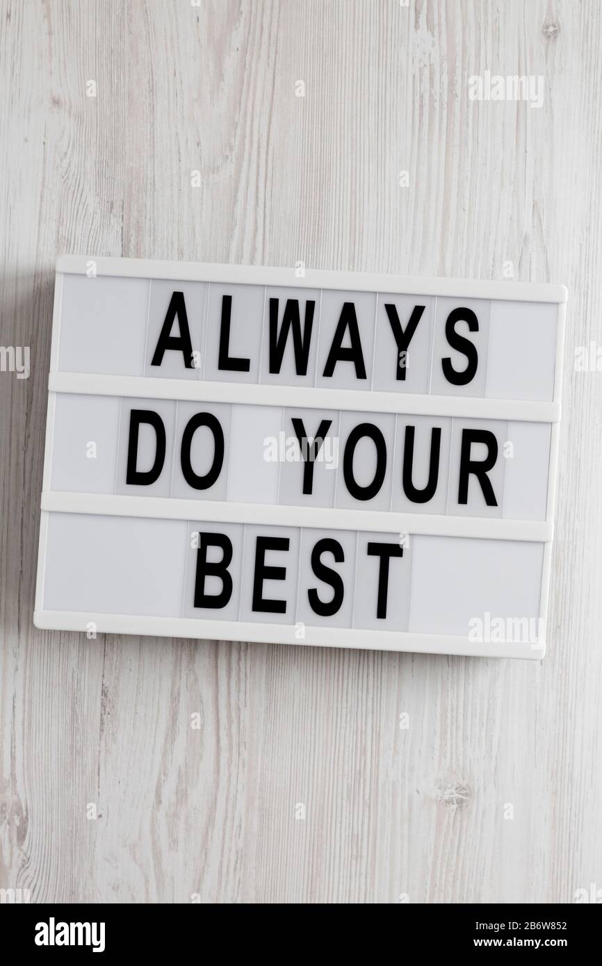 'Always do your best' words on a lightbox on a white wooden background ...