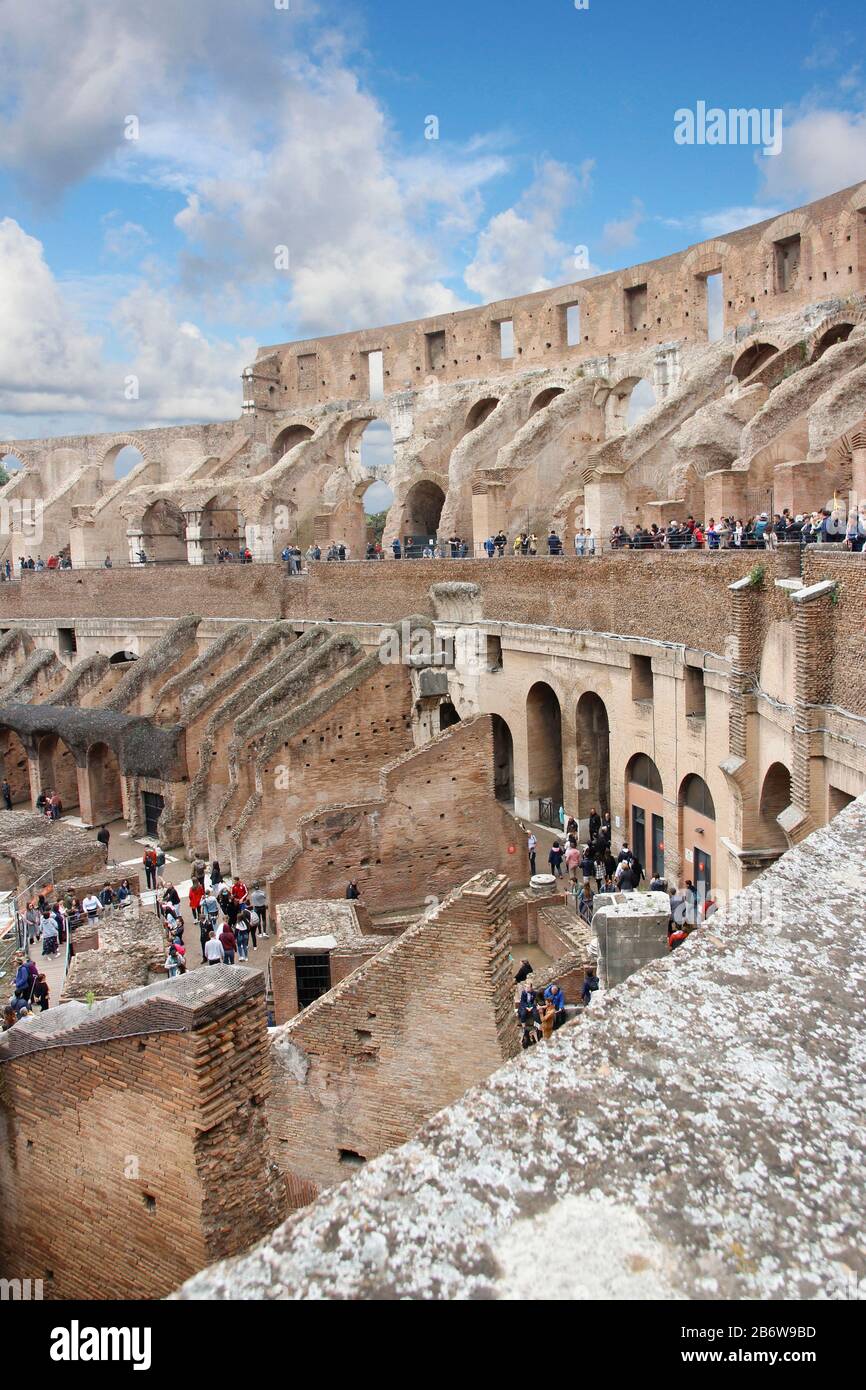 Interior of the Colosseum or Coliseum with the bricks wall and arches ...