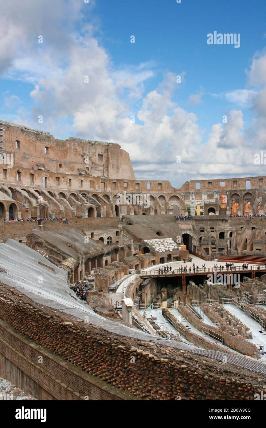 Interior of the Colosseum or Coliseum with the bricks wall and arches ...
