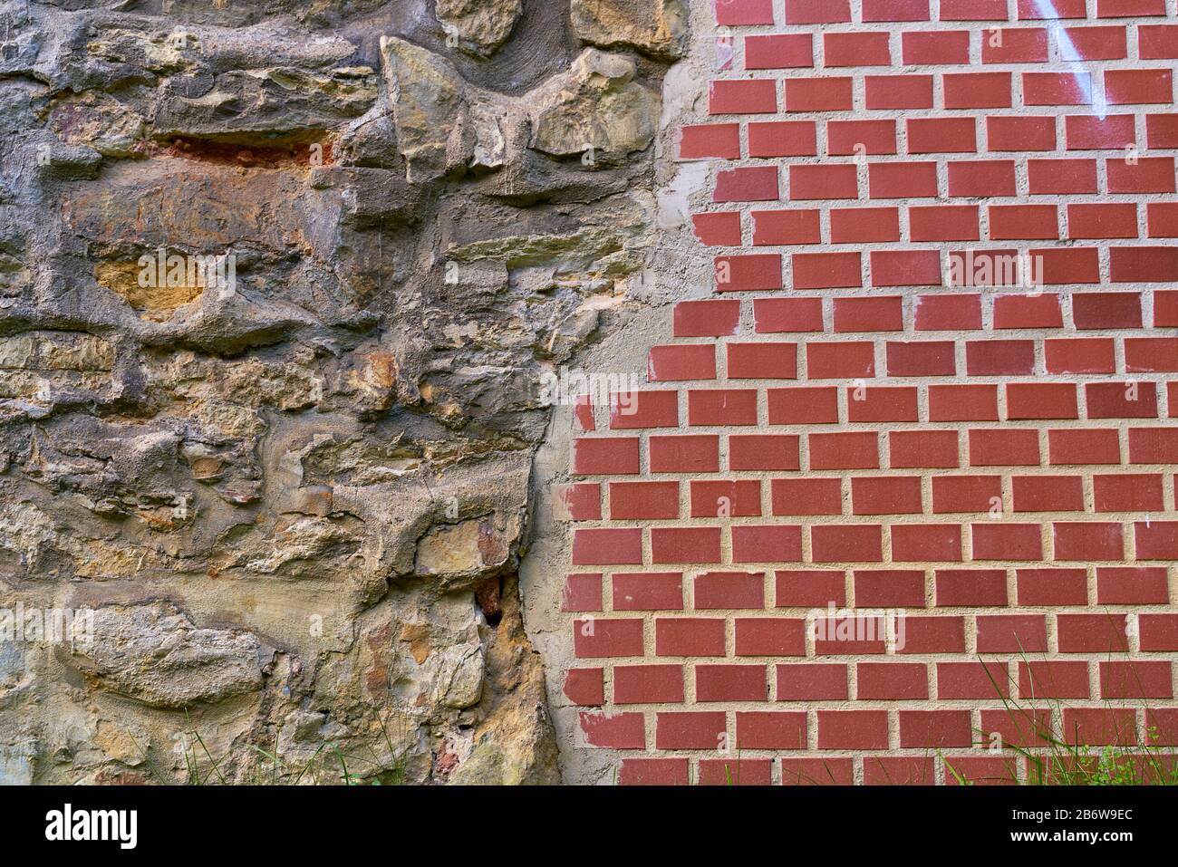 Section of new and old stone brick Stock Photo - Alamy