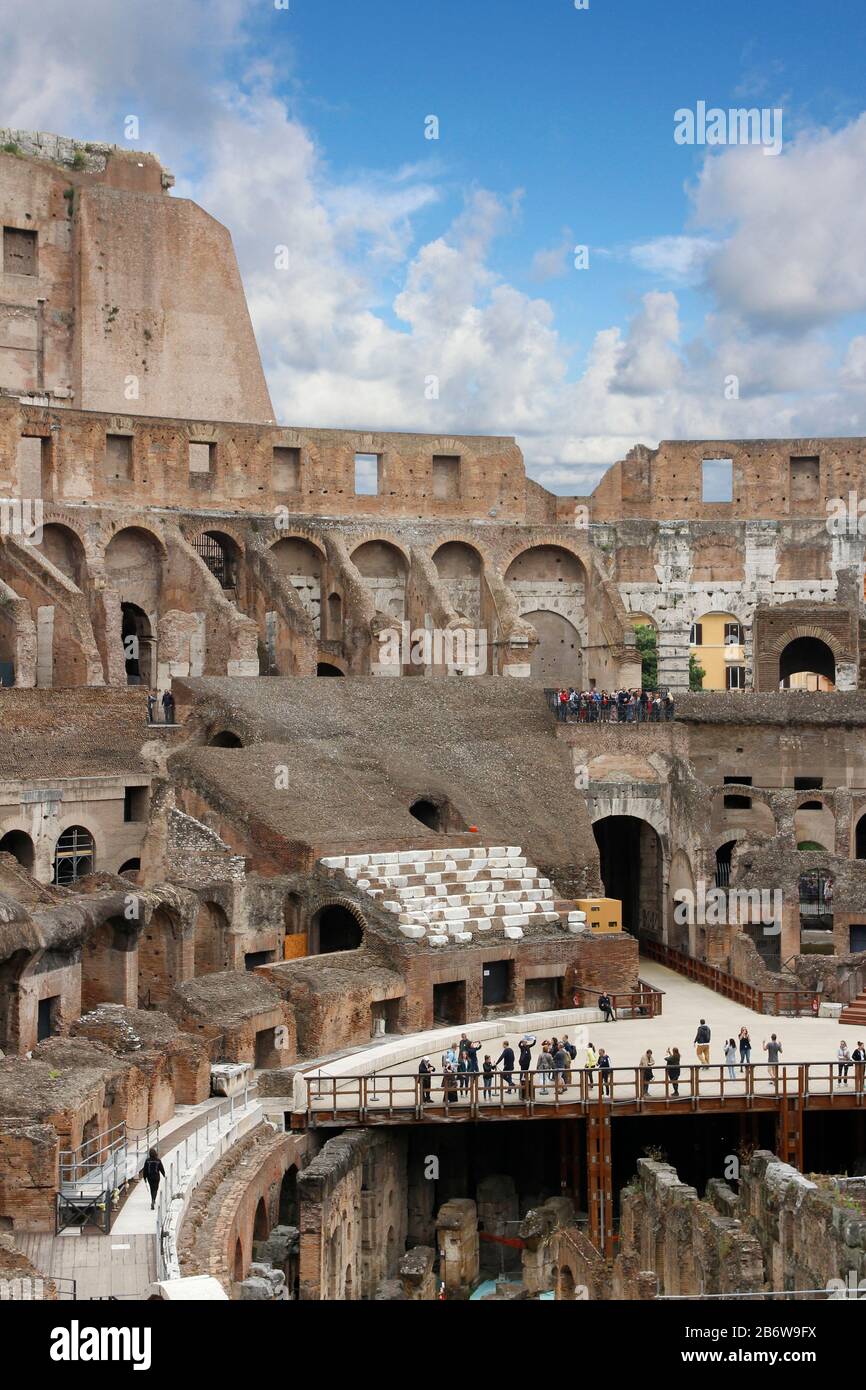 Interior of the Colosseum or Coliseum with the bricks wall and arches ...