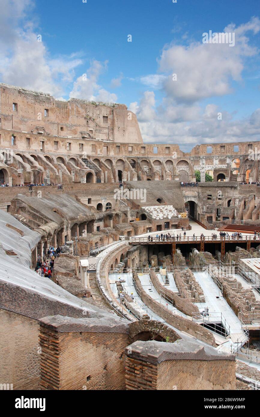 Interior of the Colosseum or Coliseum with the bricks wall and arches ...