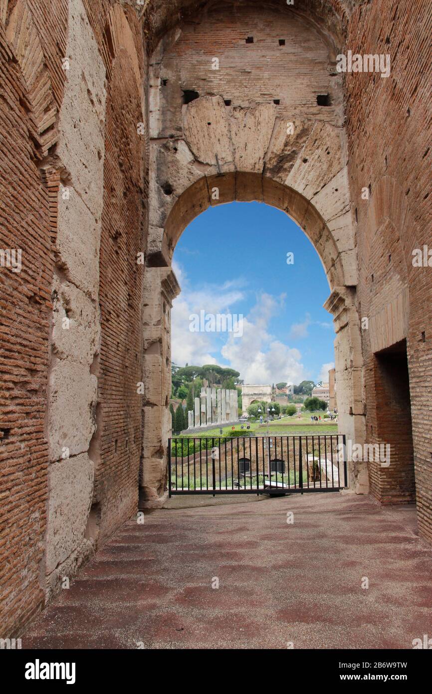 Interior of the Colosseum or Coliseum with the bricks wall and arches ...