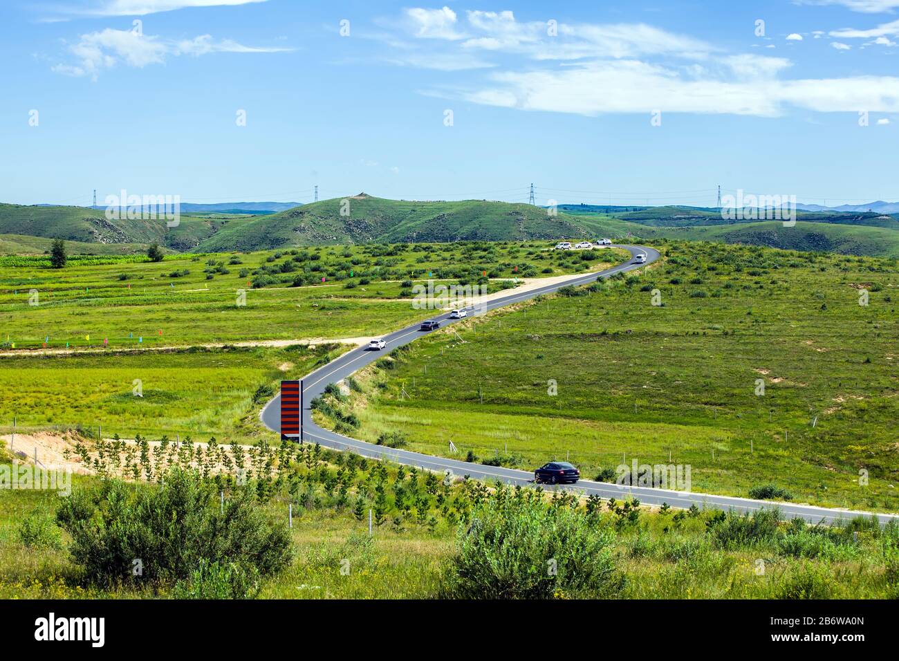 The asphalt road is on the prairie Stock Photo - Alamy