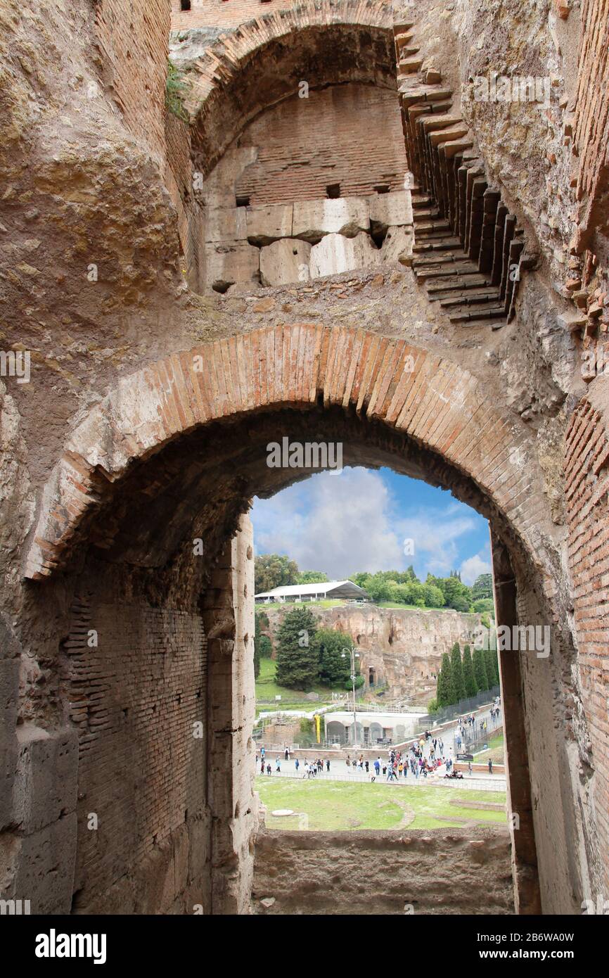 Interior of the Colosseum or Coliseum with the bricks wall and arches ...