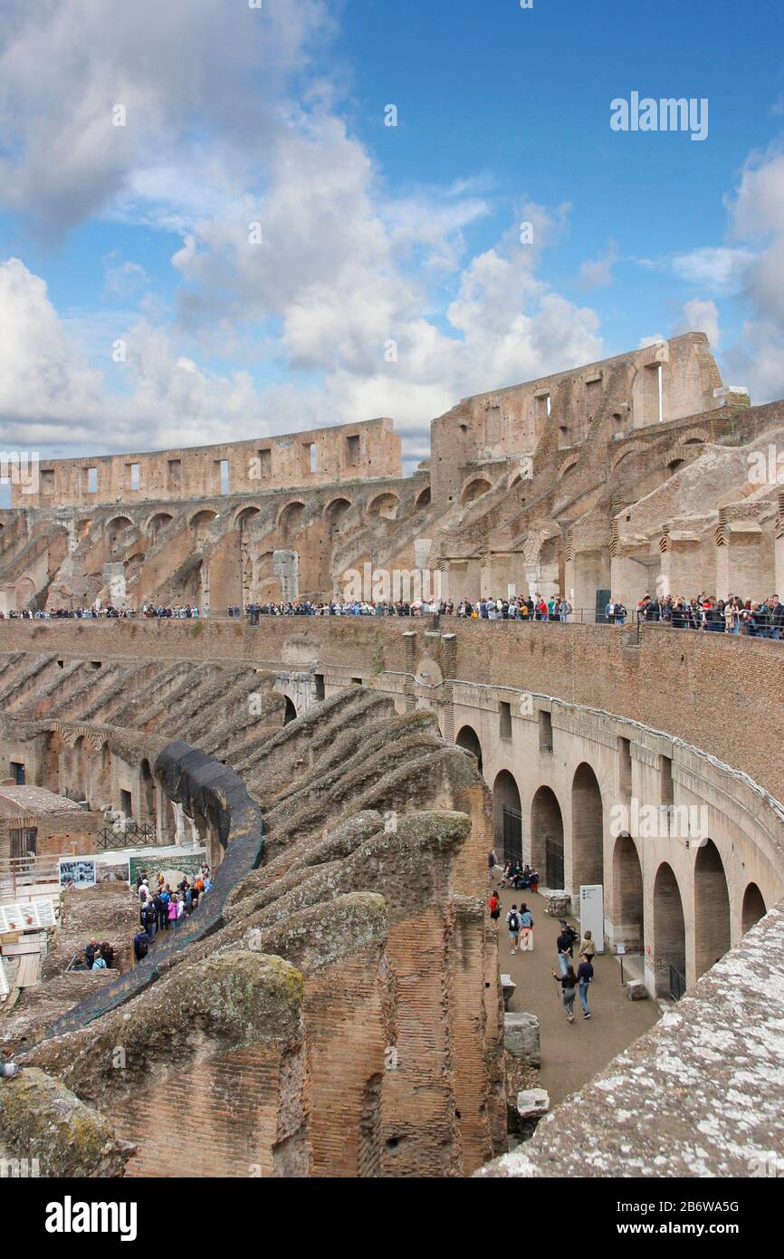 Interior of the Colosseum or Coliseum with the bricks wall and arches ...