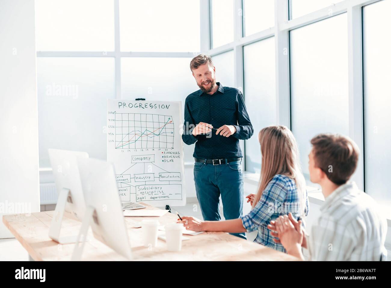 project Manager explaining to employees the new strategy of the company ...