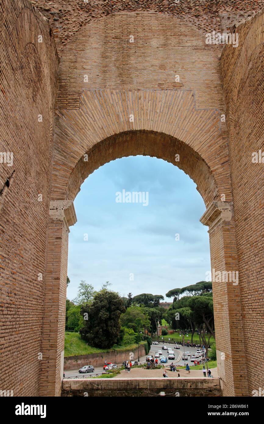 Rome city view through the arch of Colosseum or Coliseum in Rome, Italy ...