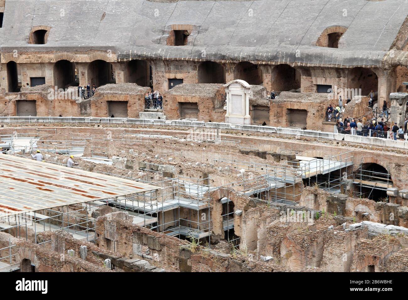 Interior of the Colosseum or Coliseum with the bricks wall and arches ...