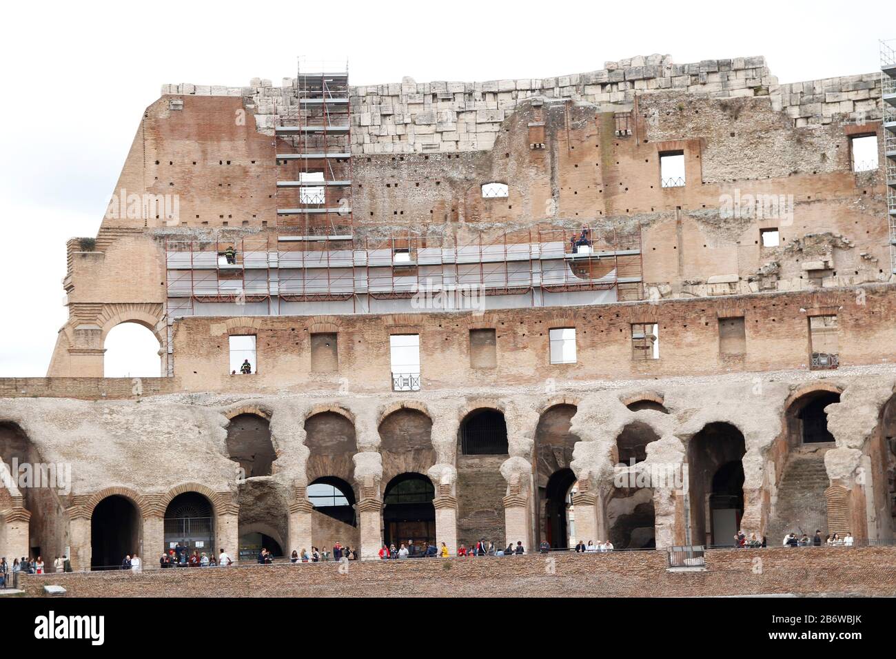 Interior of the Colosseum or Coliseum with the bricks wall and arches ...