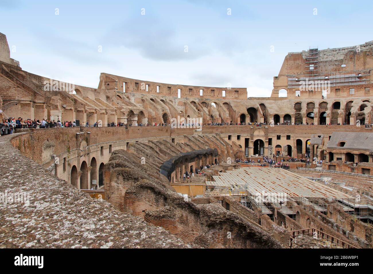 Interior of the Colosseum or Coliseum with the bricks wall and arches ...
