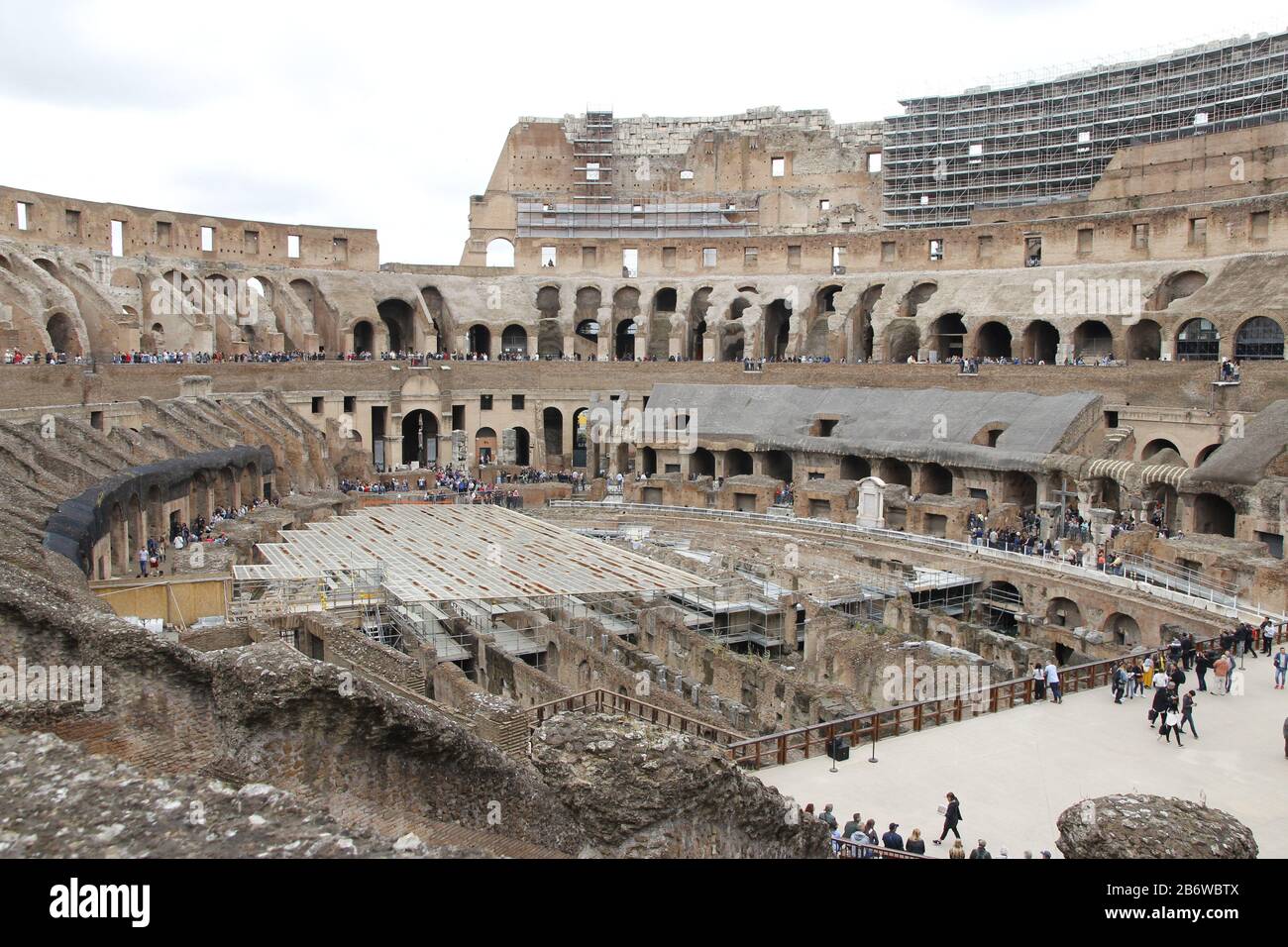 Interior of the Colosseum or Coliseum with the bricks wall and arches ...