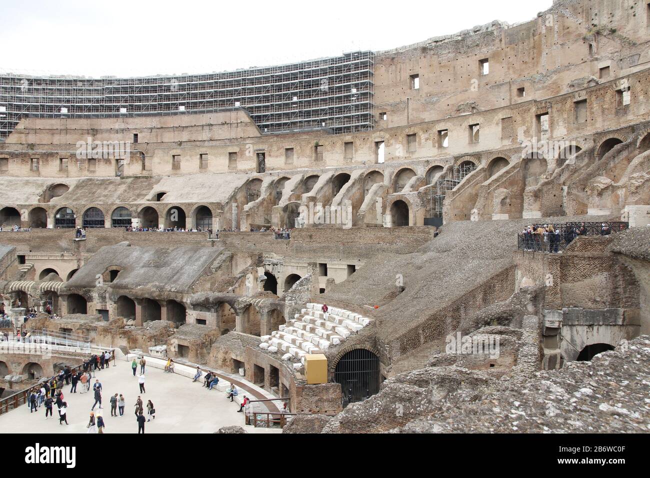 Interior of the Colosseum or Coliseum with the bricks wall and arches ...