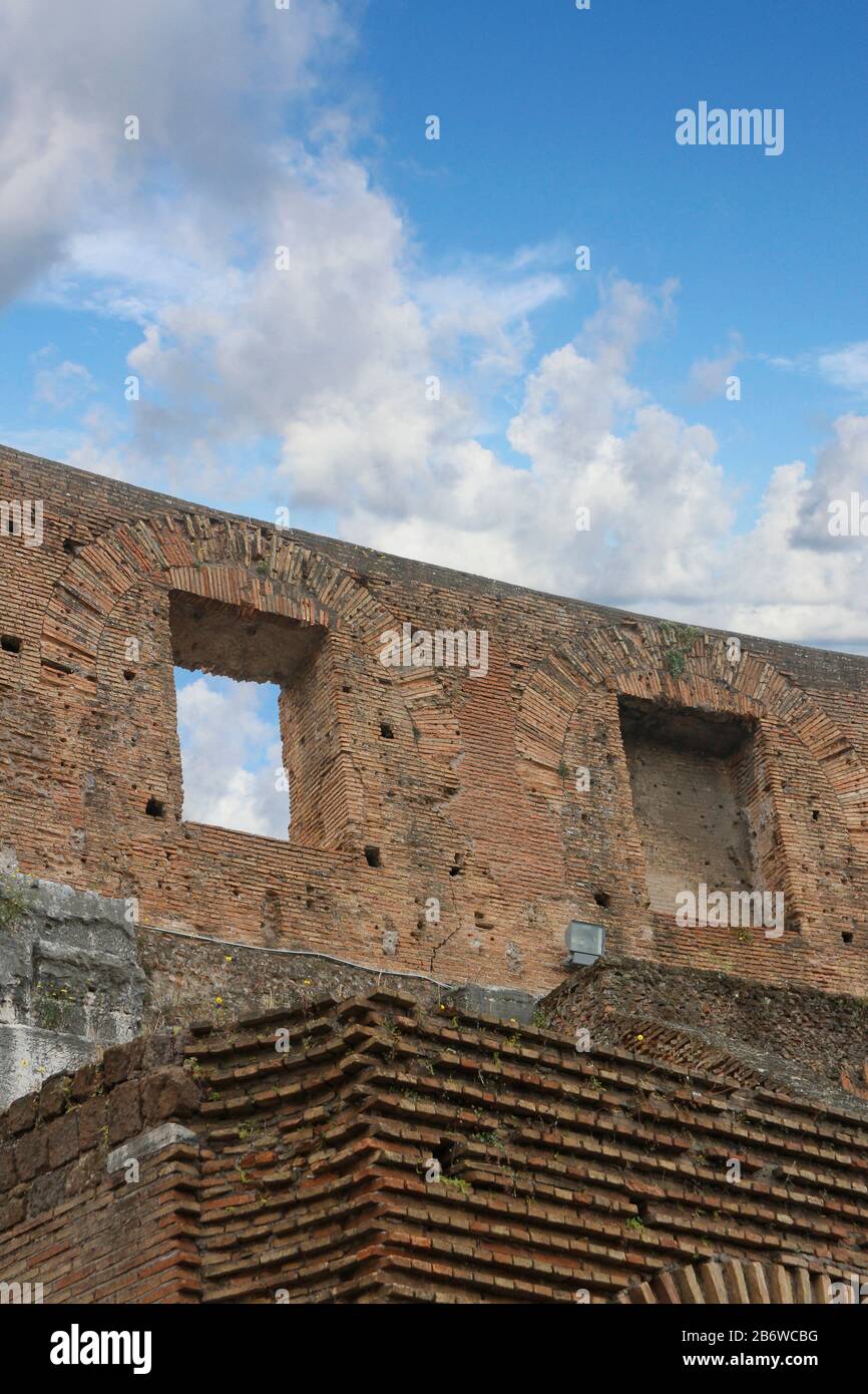 Interior of the Colosseum or Coliseum with the bricks wall and arches ...