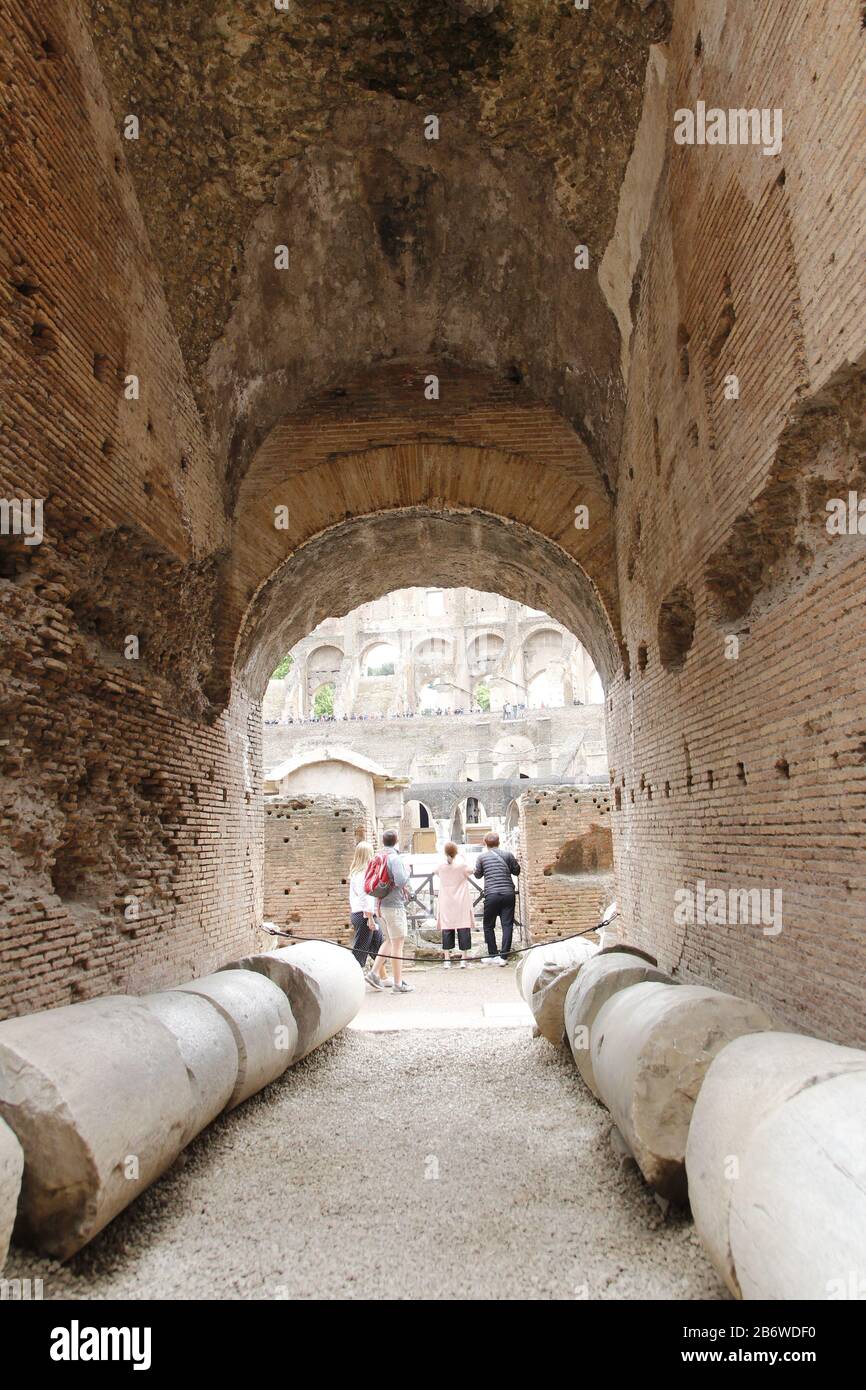 Interior of the Colosseum or Coliseum with the bricks wall and arches ...