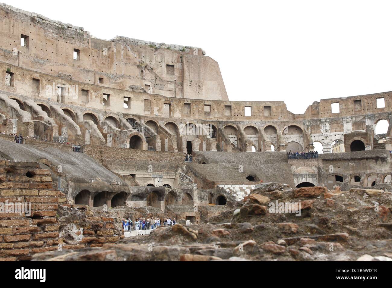 Interior of the Colosseum or Coliseum with the bricks wall and arches ...