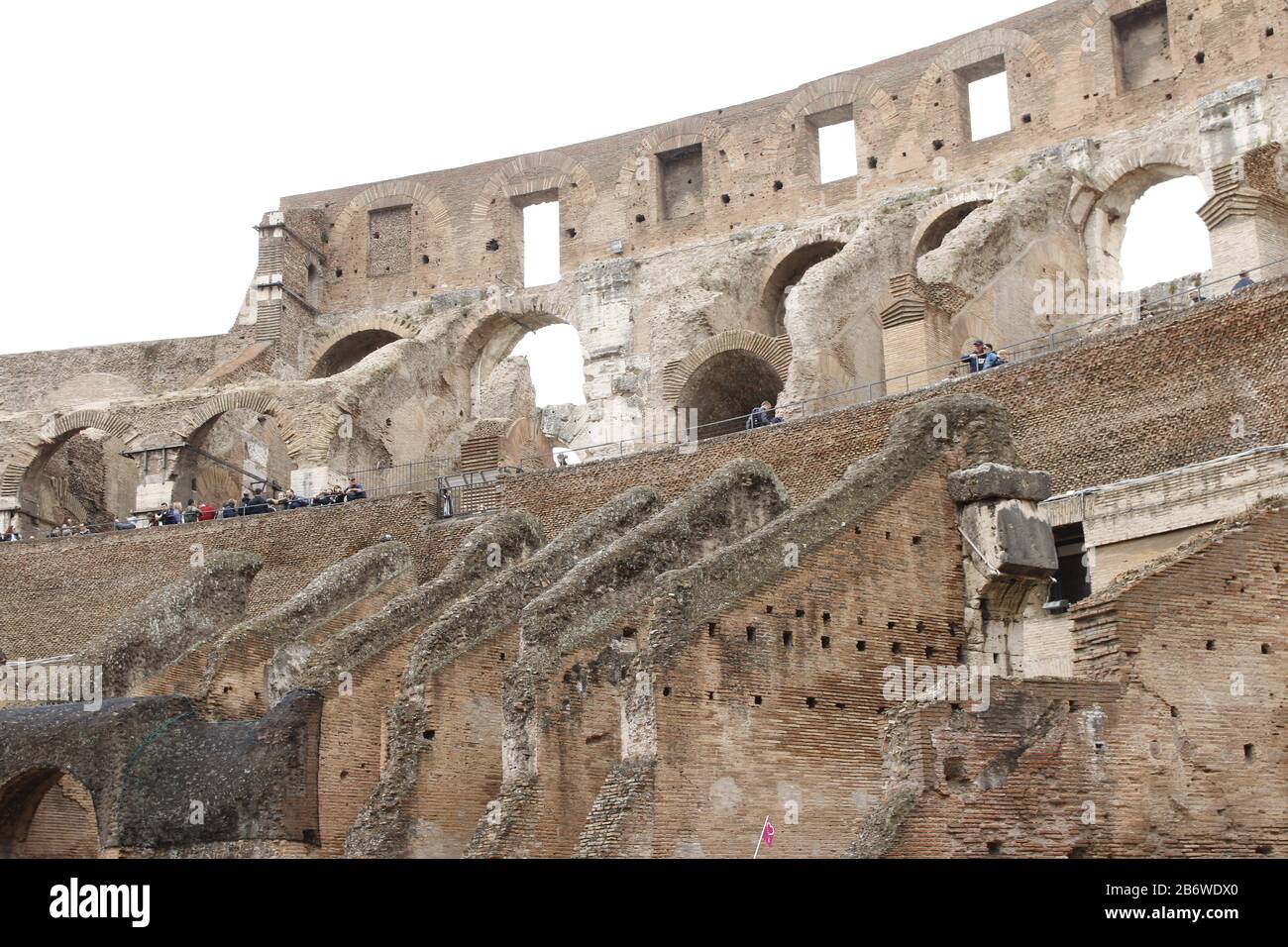 Interior of the Colosseum or Coliseum with the bricks wall and arches ...