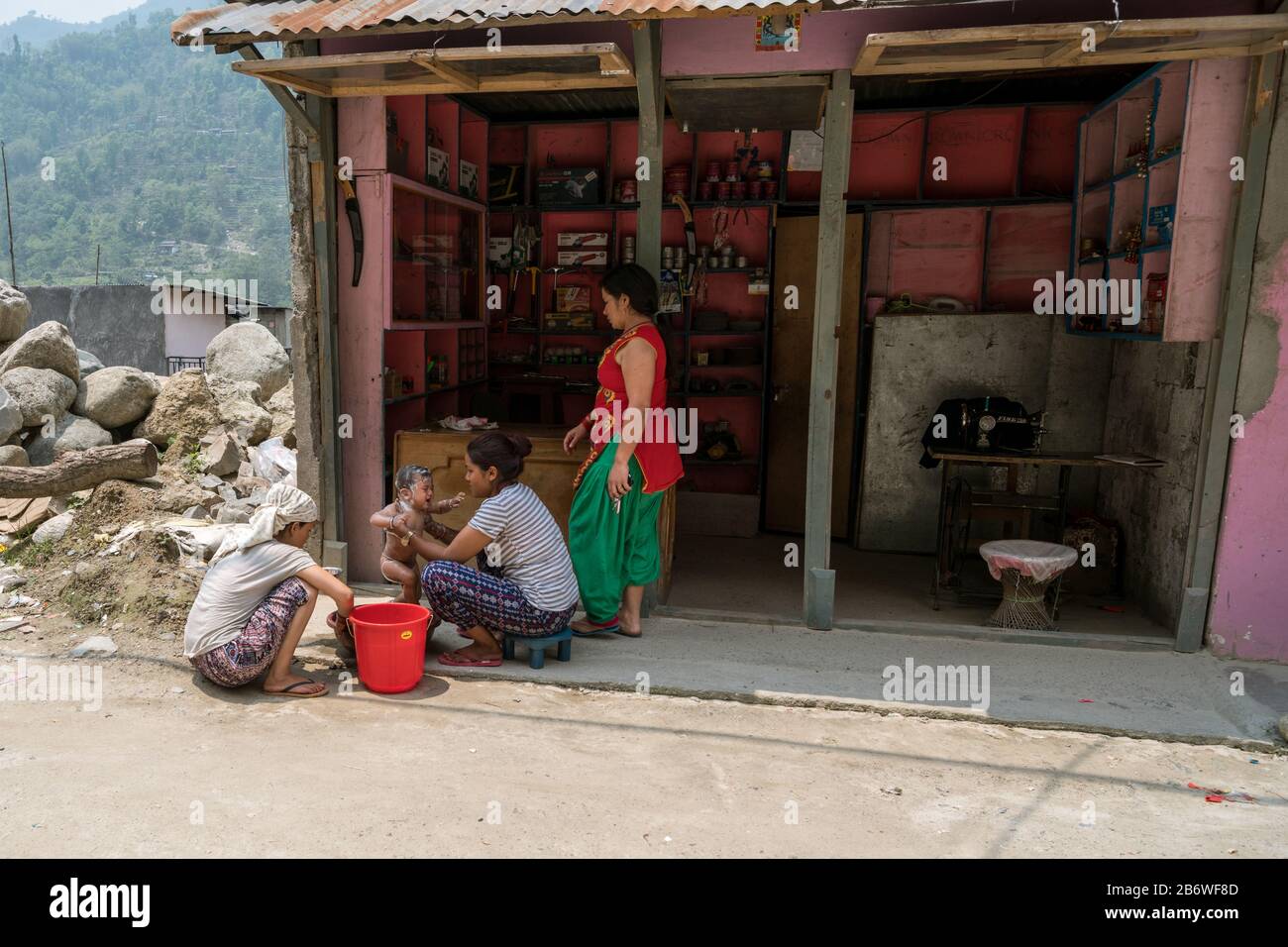 Bathing a child at Nayapul village in Nepal Stock Photo - Alamy