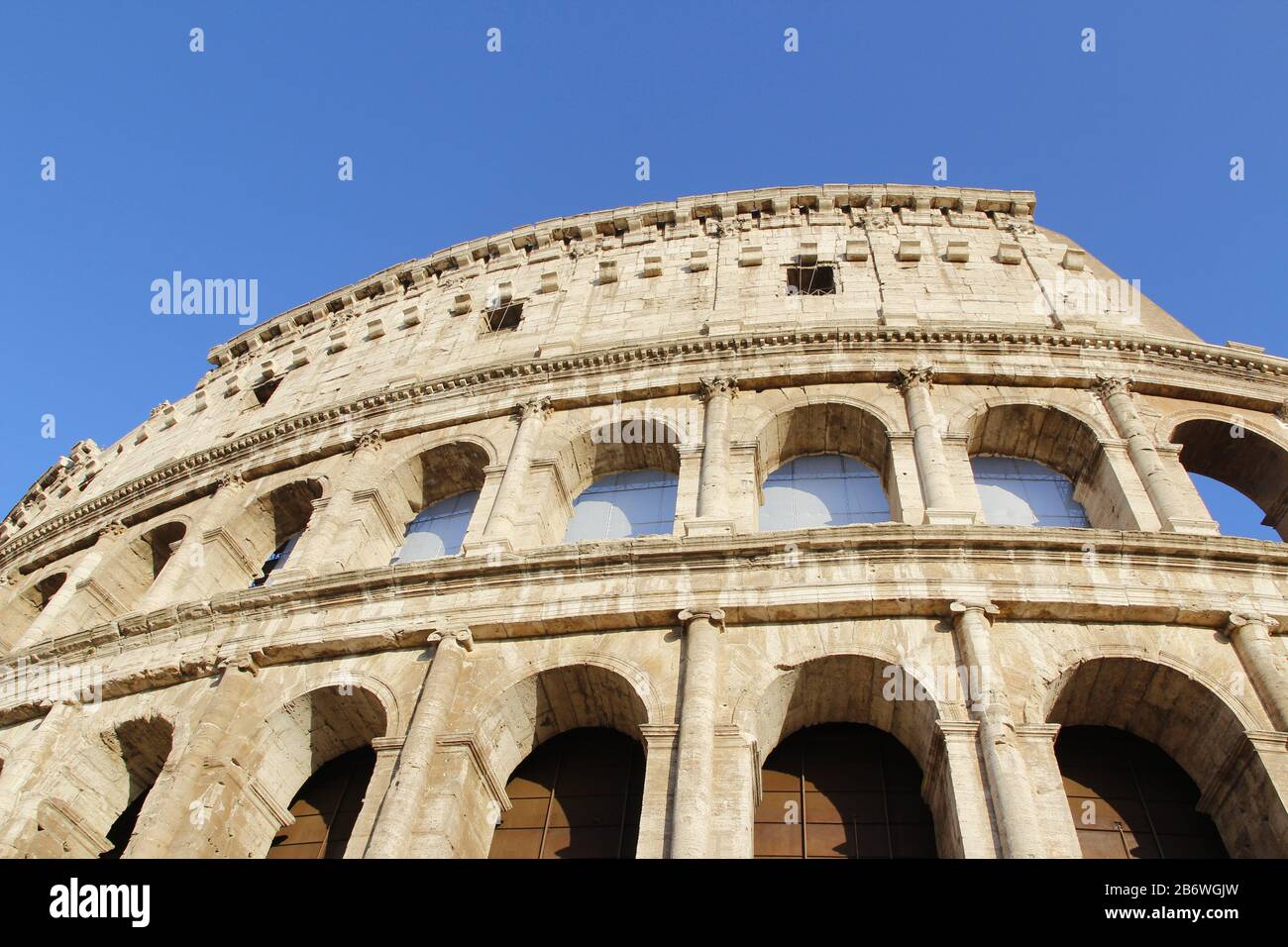 The exterior facade of the Colosseum or Coliseum with the arches ...