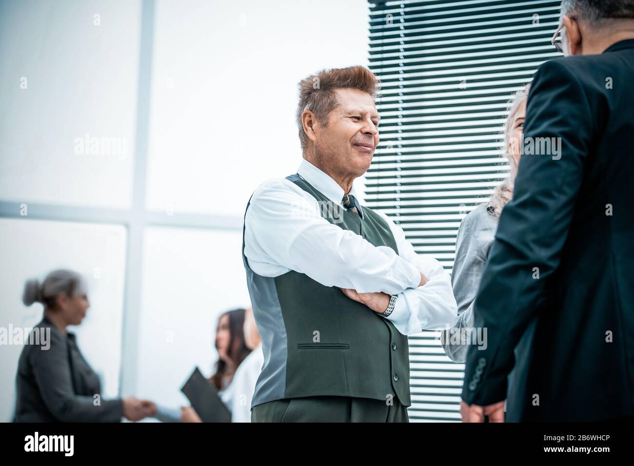 close up. serious employees discuss something standing in the office ...