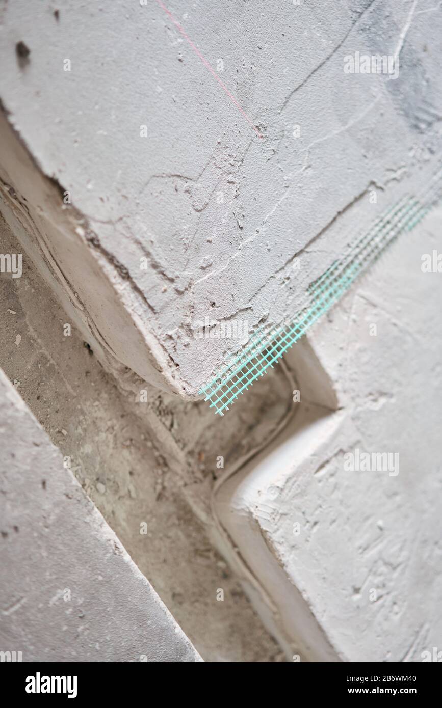 The finished floor screed is reinforced with green mesh. Repair of ...