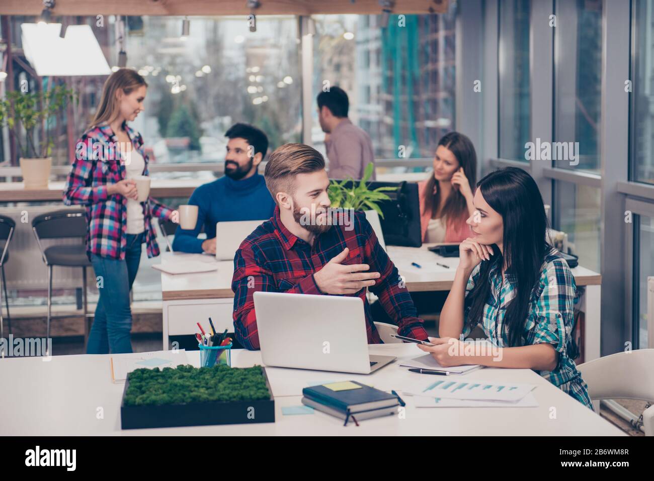 Two happy partners talking about business task Stock Photo - Alamy
