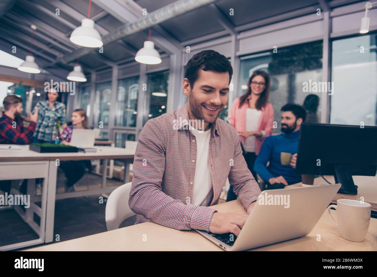 Smiling manager working on financial plan in office room Stock Photo ...