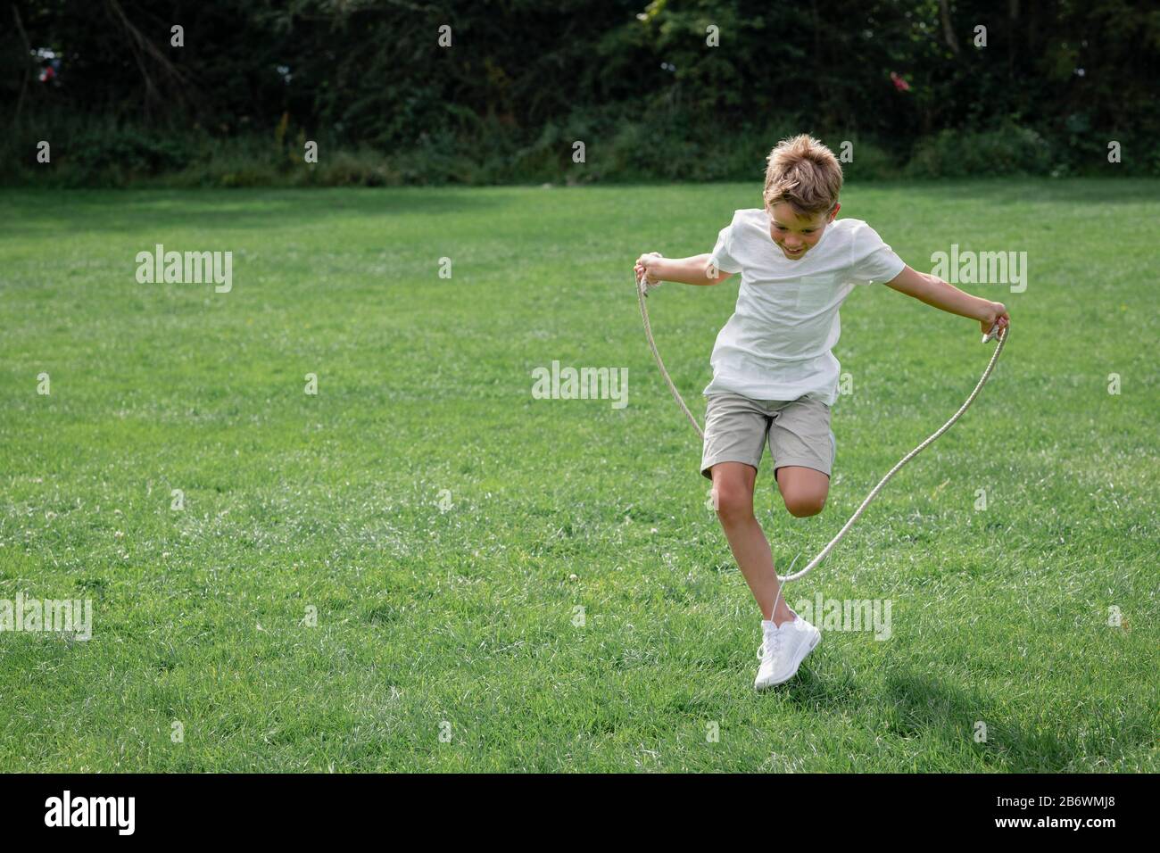 Boy skipping rope hi-res stock photography and images - Alamy