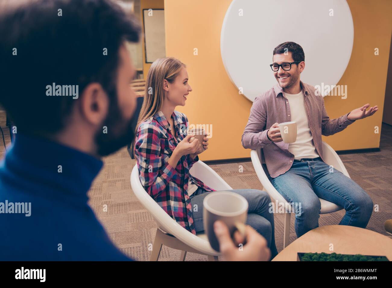 Young managers having lunch and talking while drinking coffee Stock ...