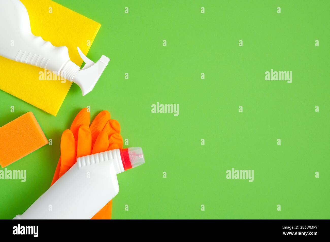 Cleaning tools and supplies on green background. House cleaning service ...