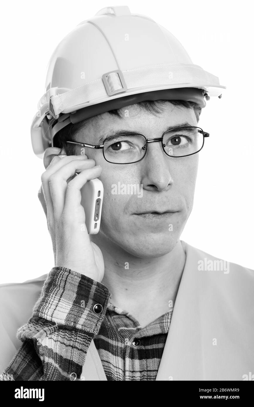Face of man construction worker talking on the phone Stock Photo - Alamy