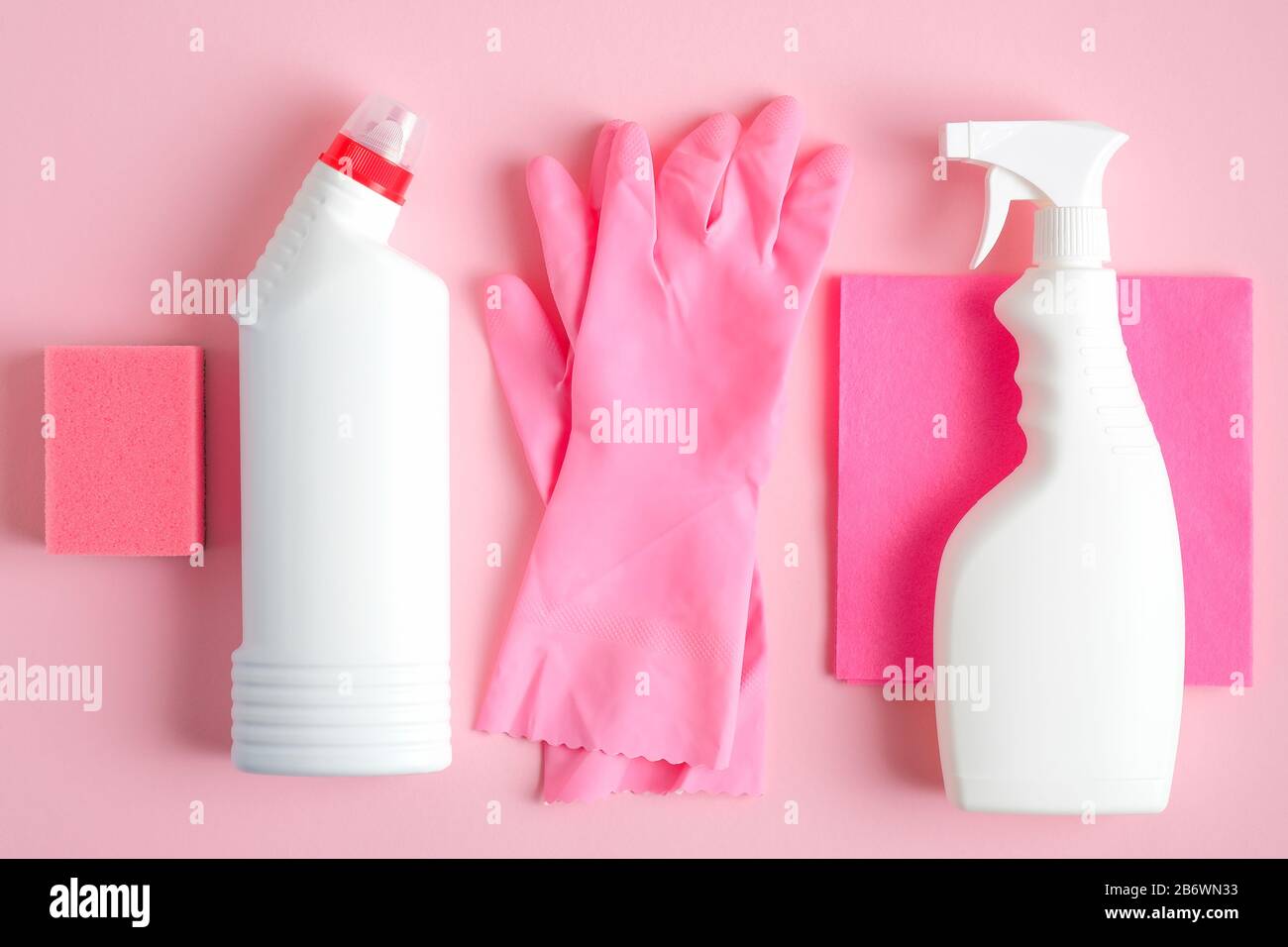 Set of cleaning supplies on pink background. House cleaning service and ...