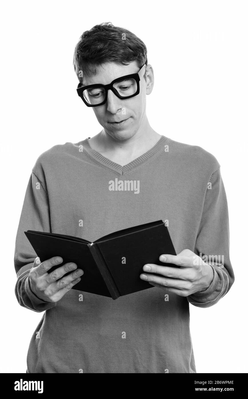Portrait of nerd man reading book with eyeglasses Stock Photo - Alamy