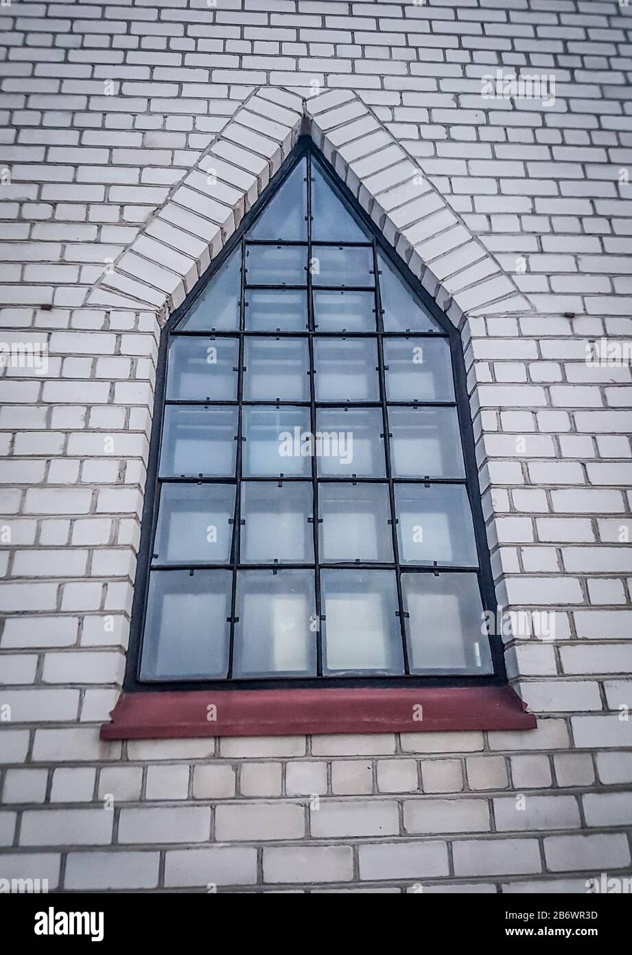 window on the wall of the Catholic Church Stock Photo - Alamy