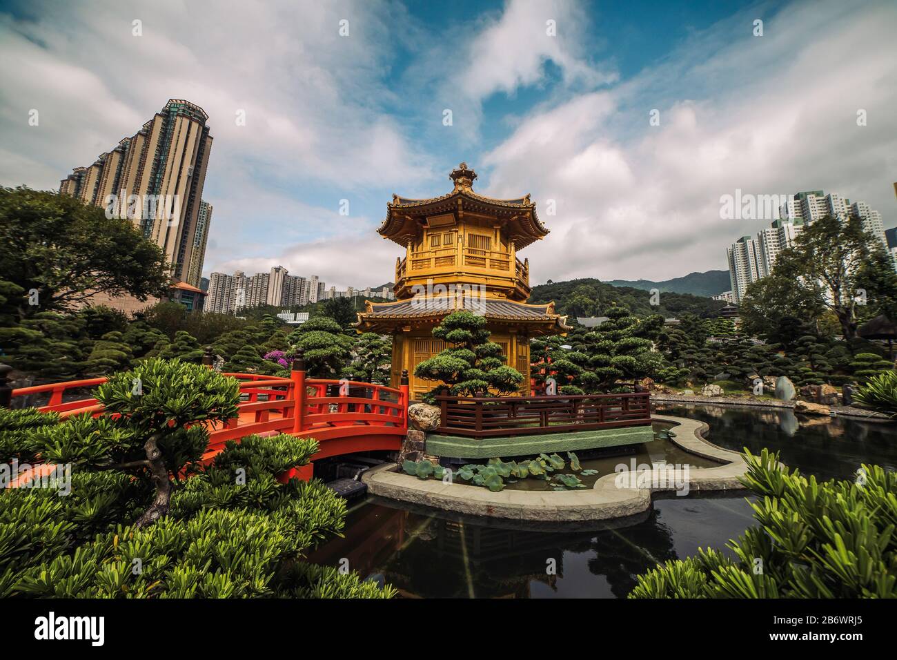 Traditional chinese yellow temple with garden and bridge and ...