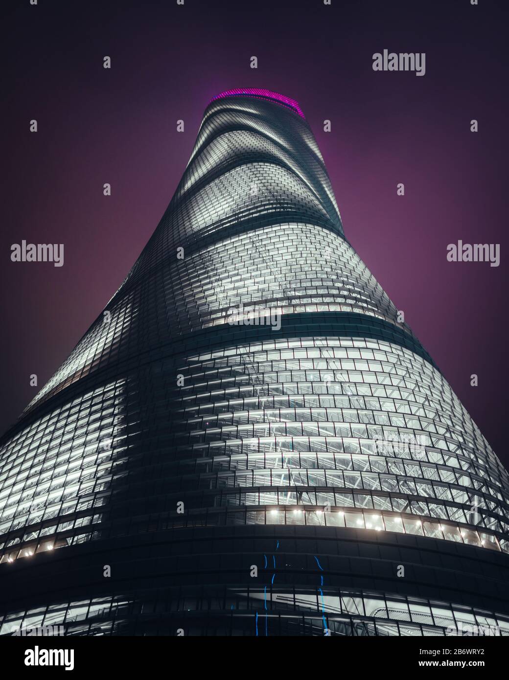 Shanghai Business area skyscrapers upclose at night with neon light ...