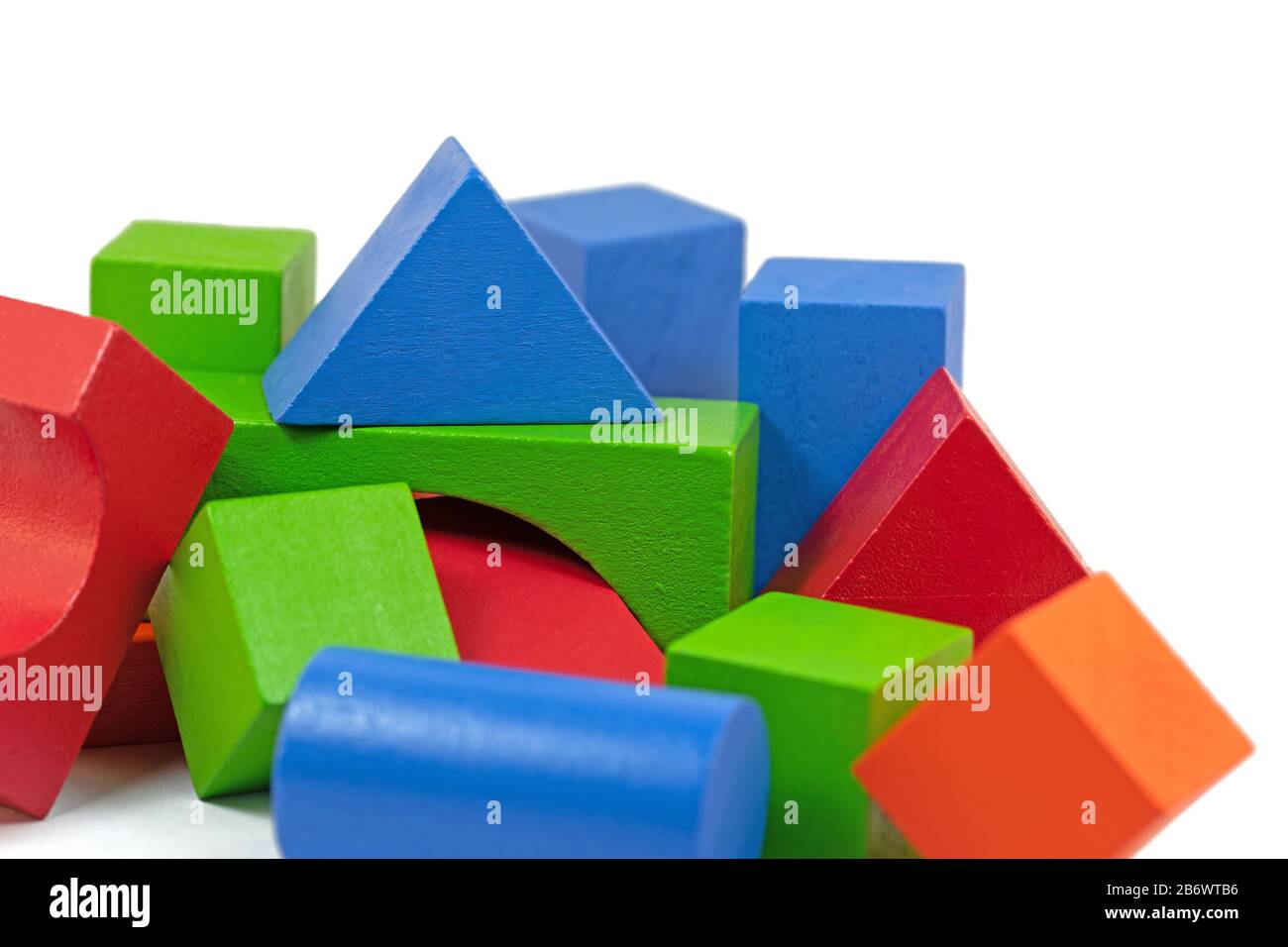 Colorful wooden toy blocks against white background Stock Photo - Alamy