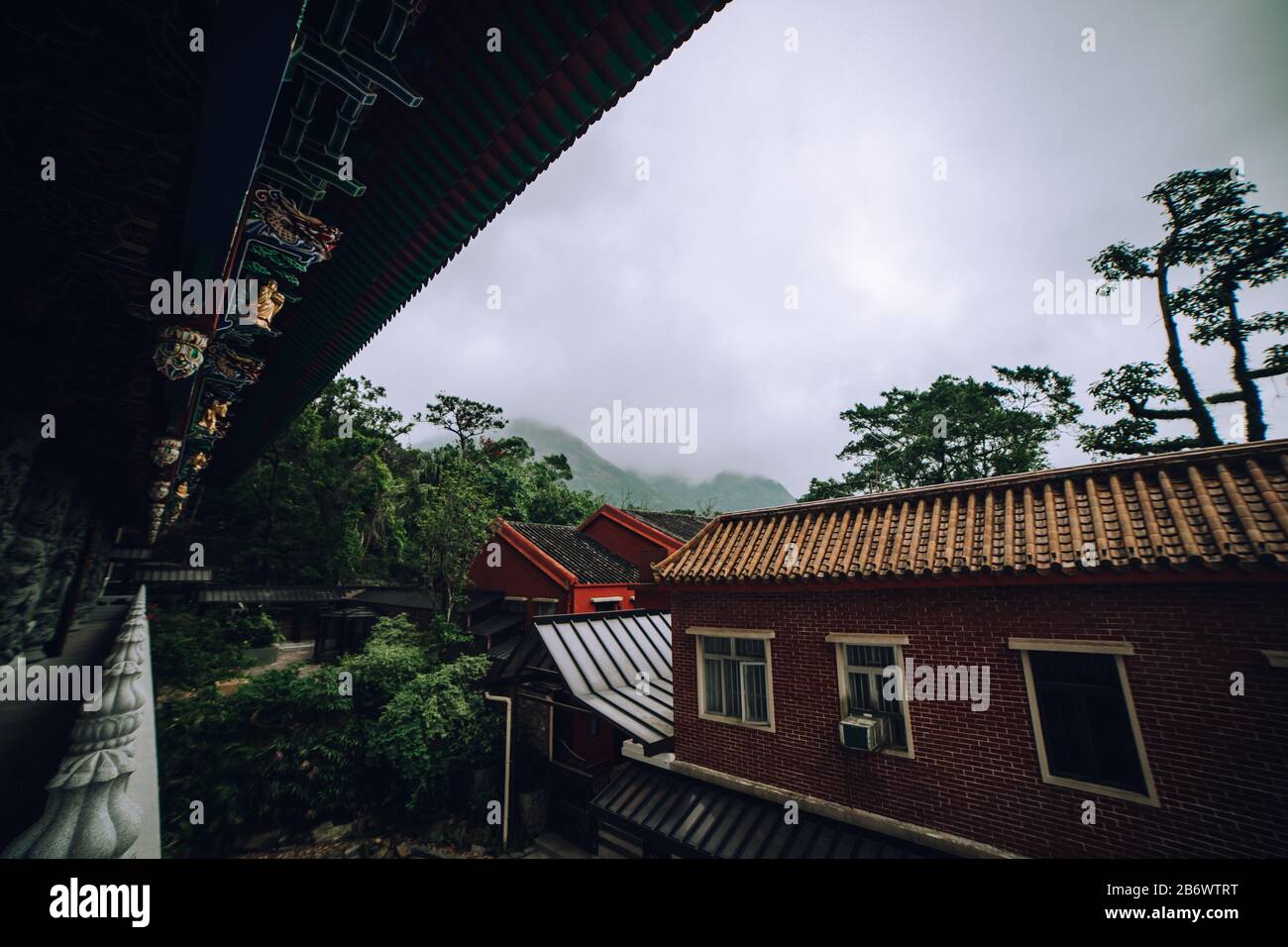 Chinese jungle with traditional temple and buildings Stock Photo - Alamy