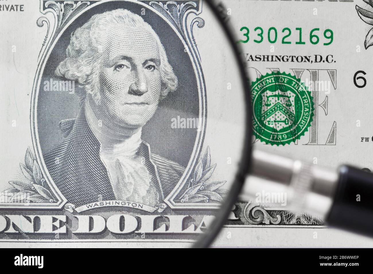 Magnifying dollar bill magnifying glass hi-res stock photography and ...