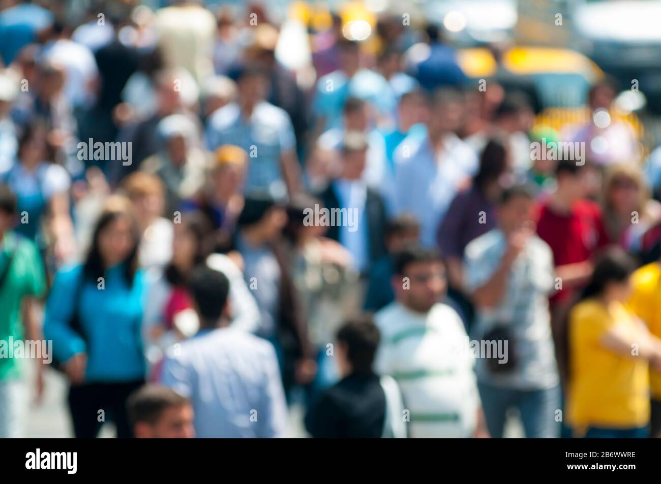 Crowded city street full of unrecognizable people walking in colorful ...