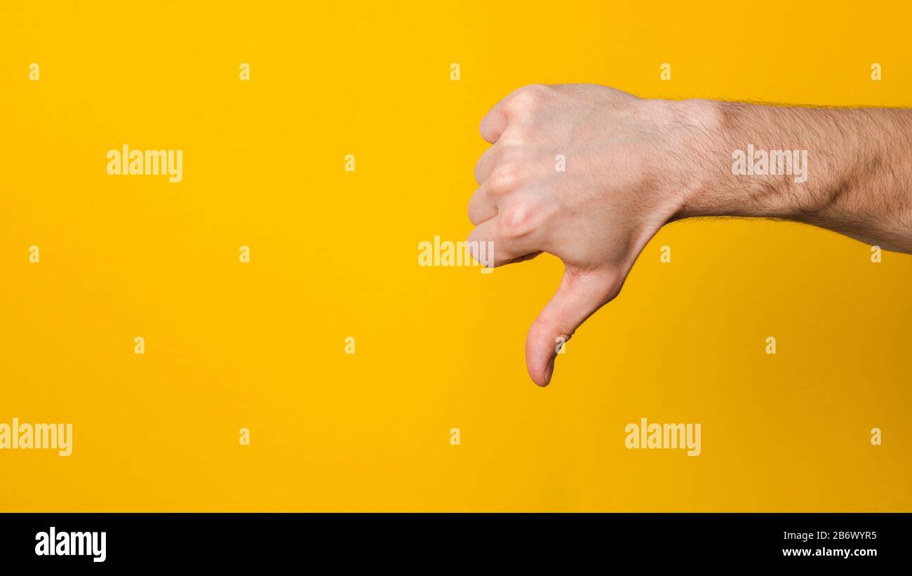 not good and not approved. close up hand of a man showing thumb down ...