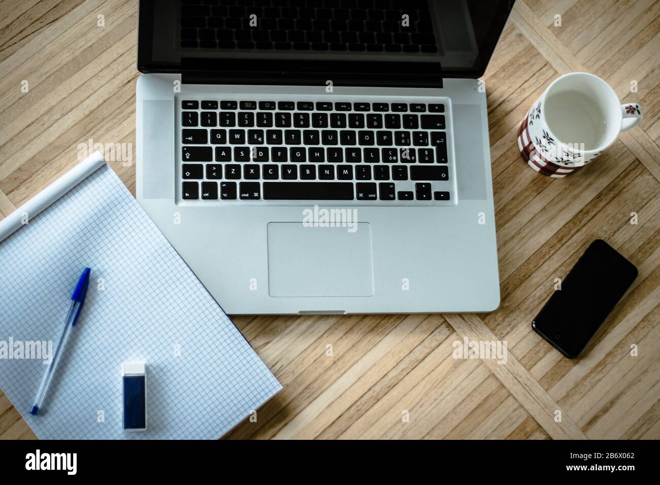 Working On Wooden Desk - This still life image showcases a personal ...