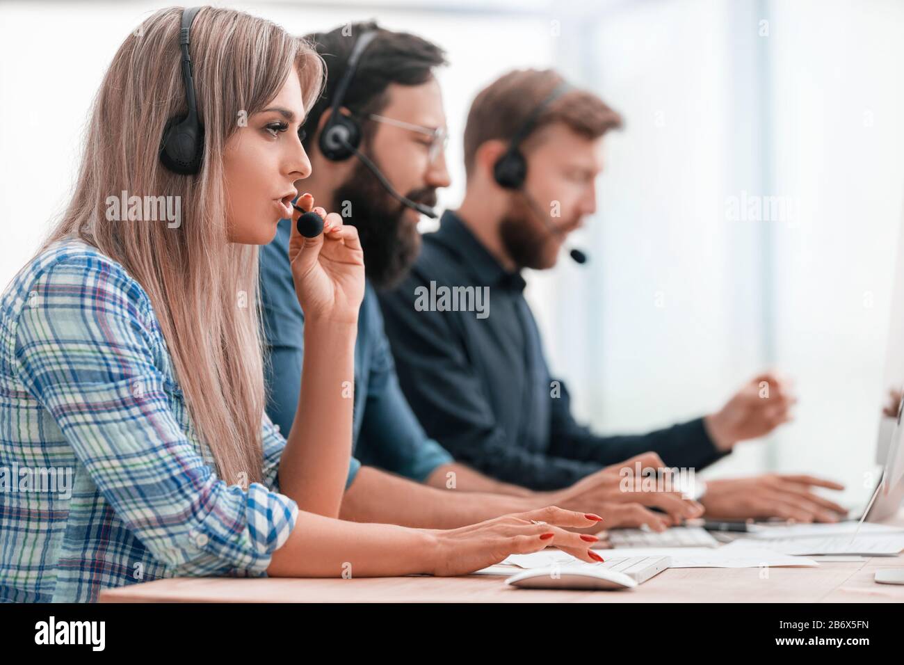 close up. young call center employee in the workplace Stock Photo - Alamy